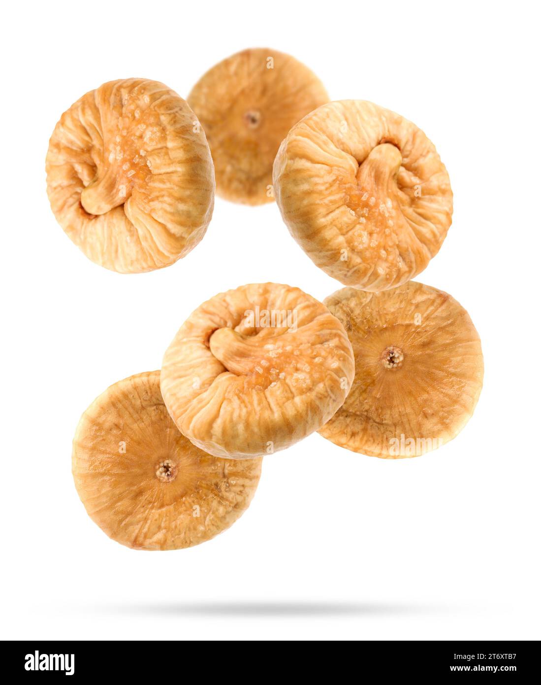 Many dried figs falling on white background Stock Photo - Alamy