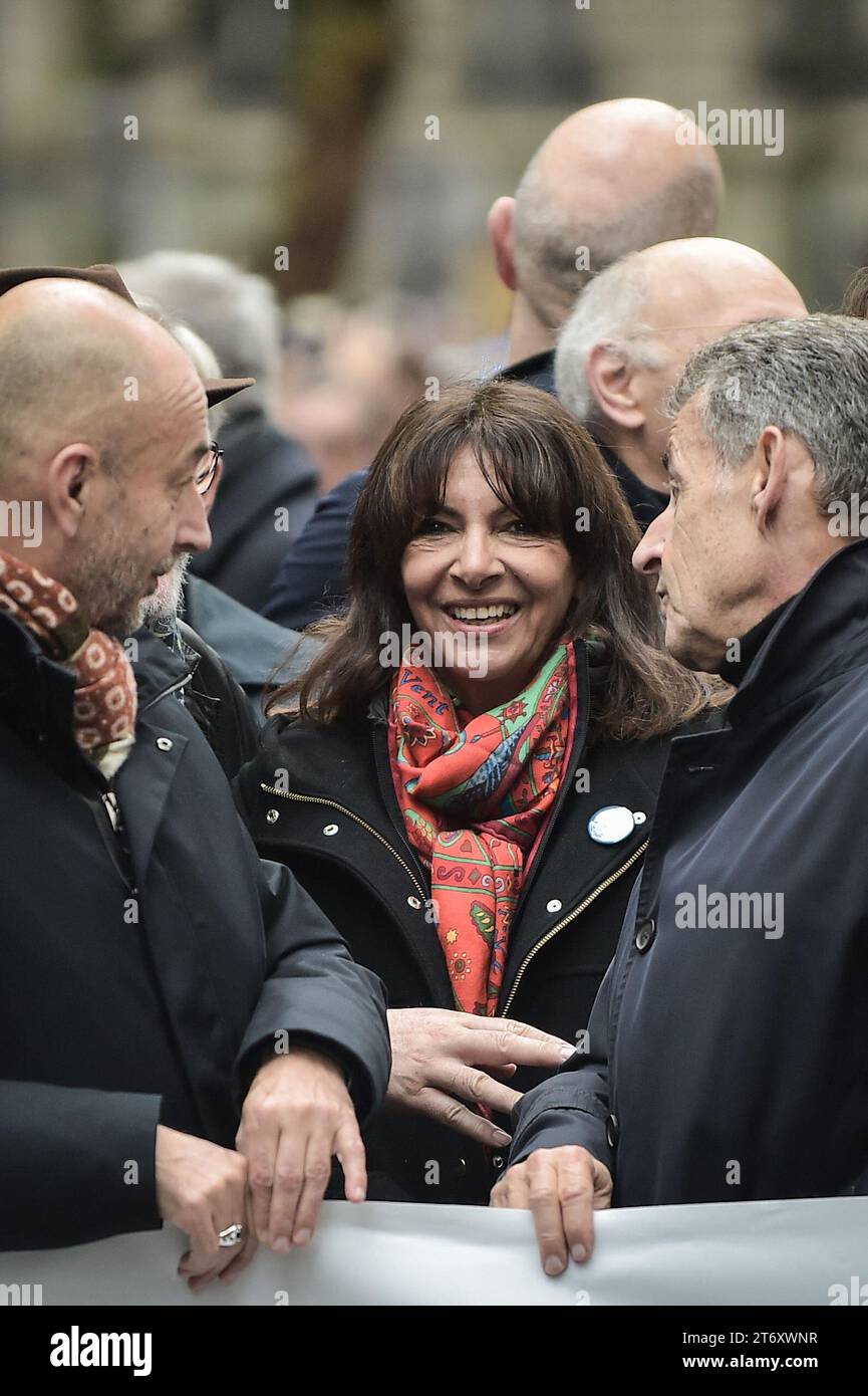 Paris Mayor Anne Hidalgo (C) marches in a march against anti-semitism ...