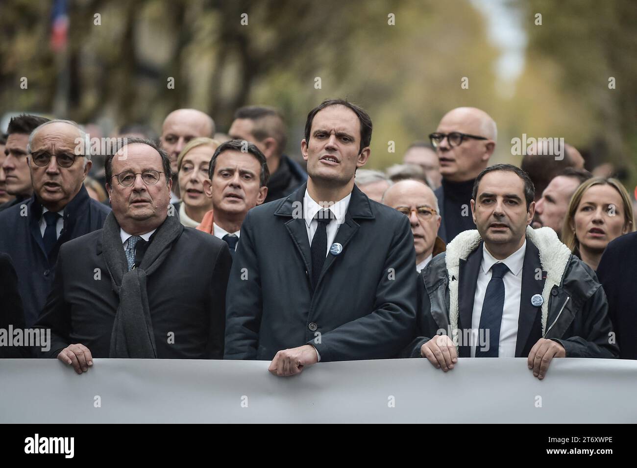 Former French President Francois Hollande (L) participates with ...