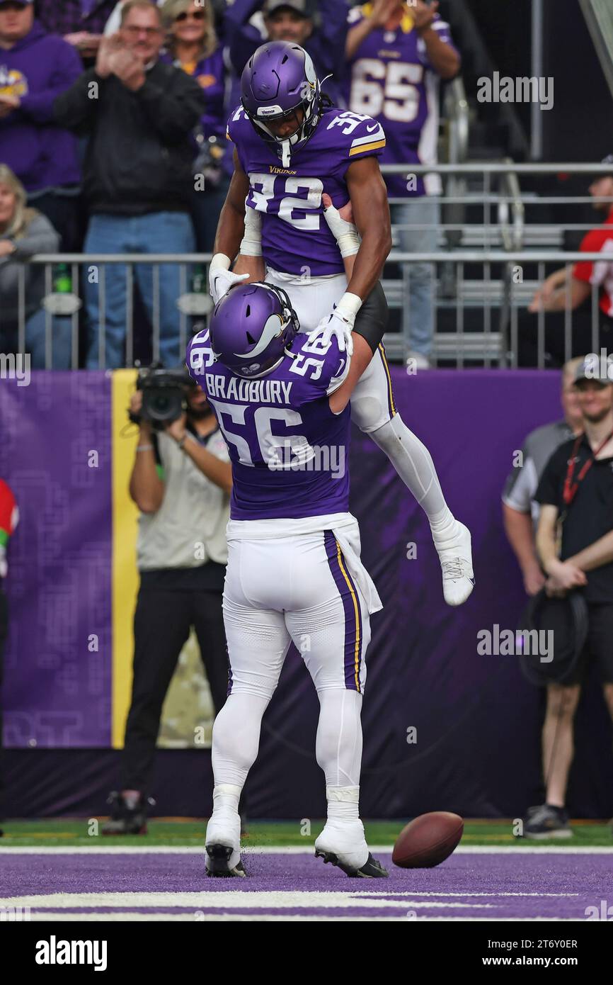 Minnesota Vikings running back Ty Chandler (32) celebrates with center ...
