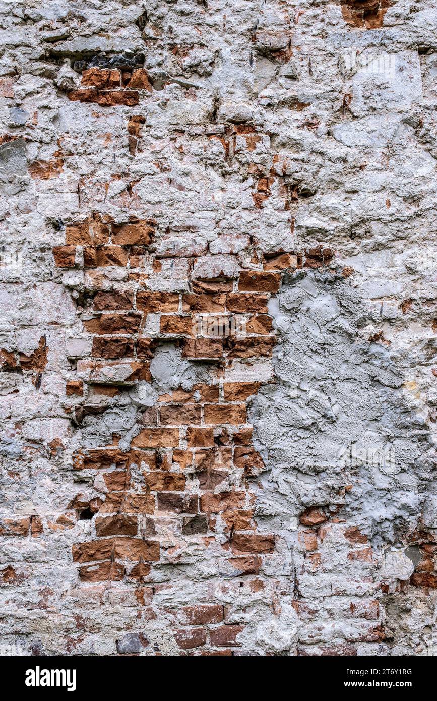 Brick wall with crumbling plaster on old building Stock Photo - Alamy