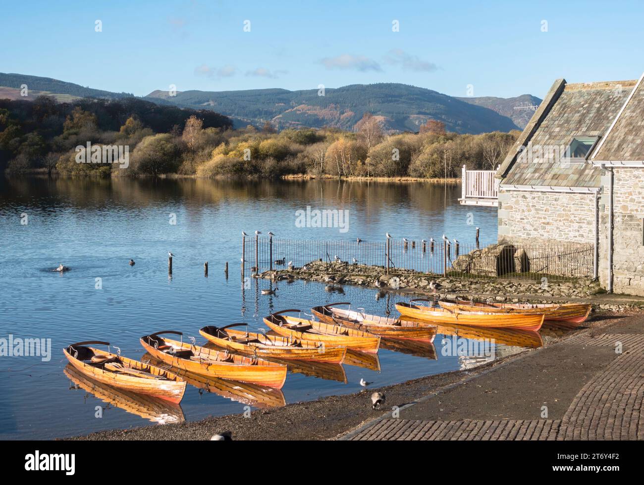 Autumn view of wooden rowing boats at Dewentwater lakeside, Keswick ...