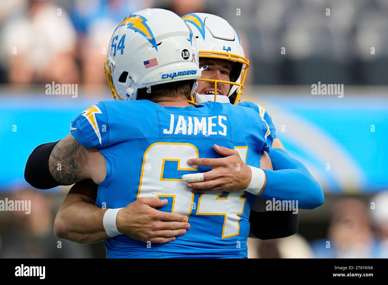 Los Angeles Chargers quarterback Justin Herbert (10) hugs guard Brenden ...