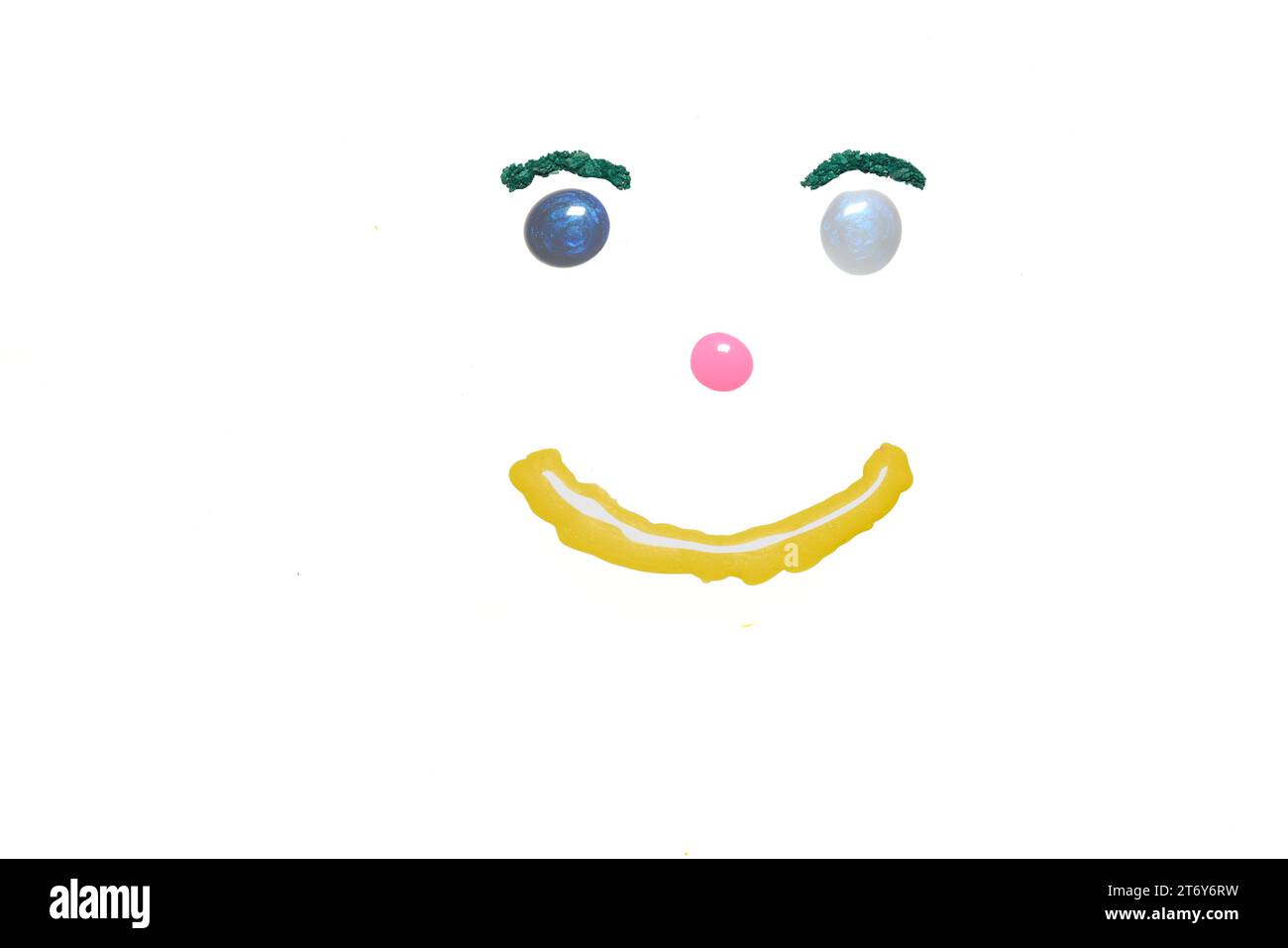 Smiley face vibrantly created using nail polish, relates to happiness ...