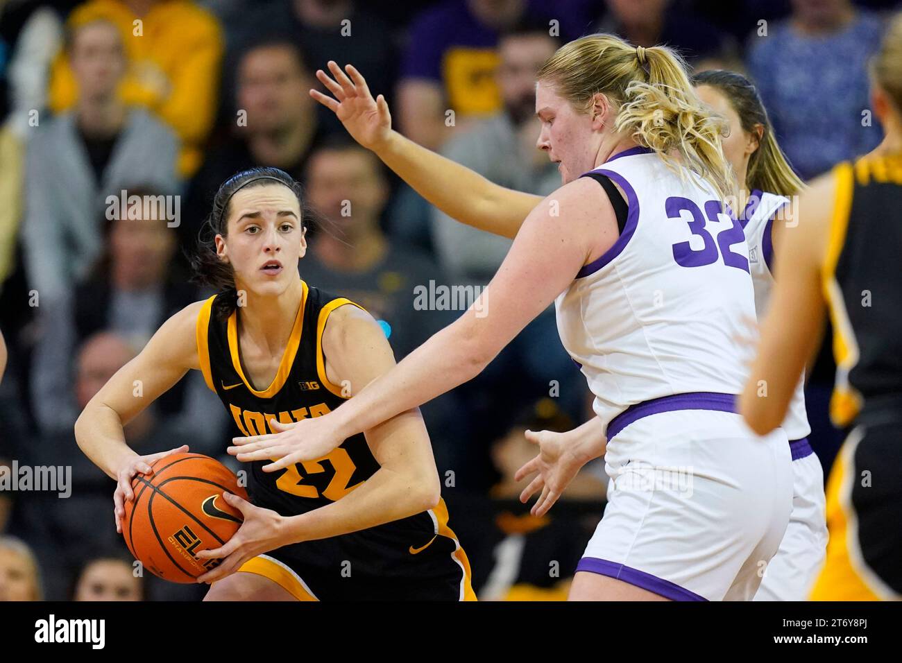 Iowa guard Caitlin Clark (22) passes around Northern Iowa center ...