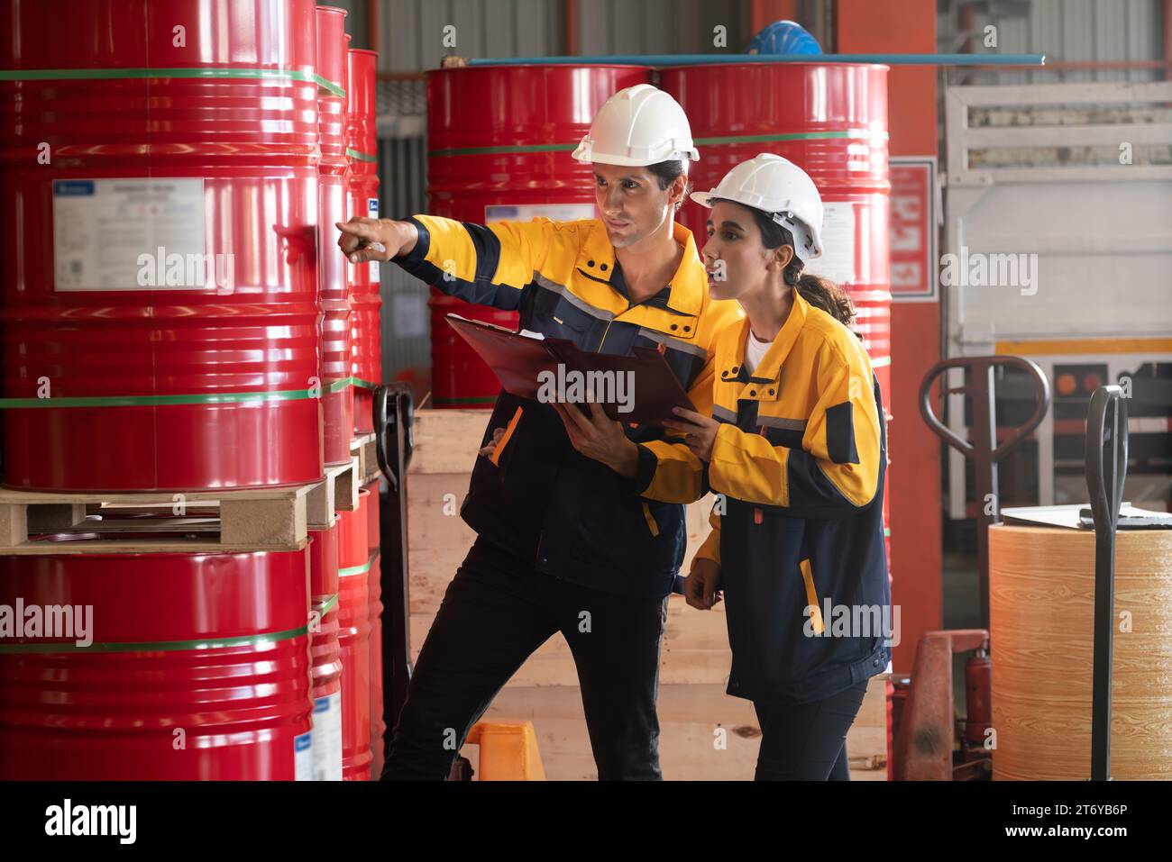 Two factory workers or inventory inspector conduct professional ...