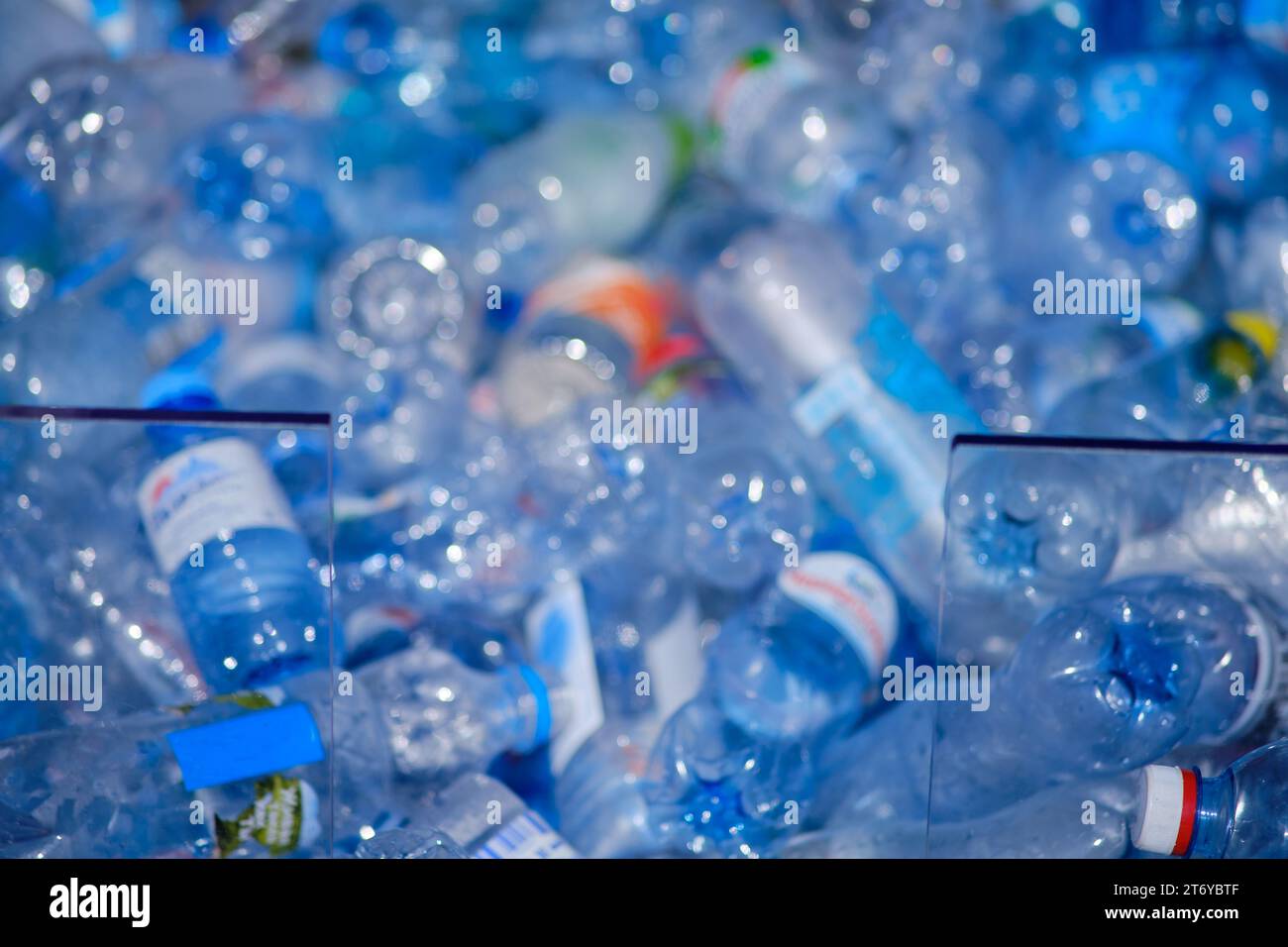 Plastic bottles of water in trash can for recycling center Stock Photo ...
