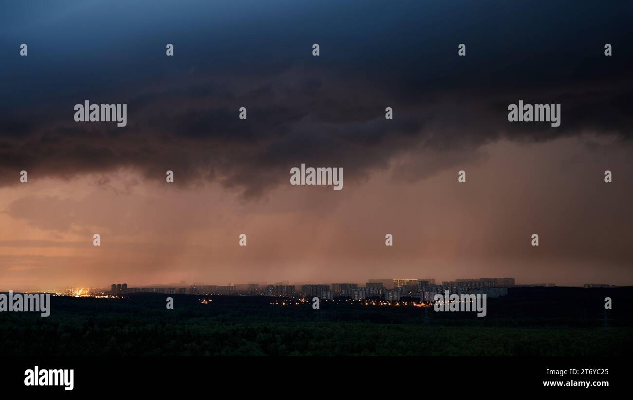 Black clouds in the sky signal an impending thunderstorm and heavy rain ...