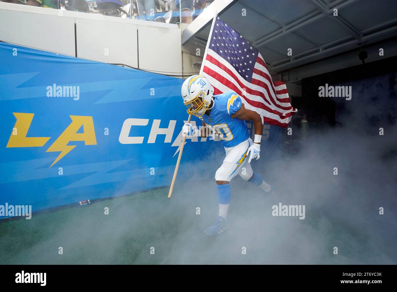 Los Angeles Chargers running back Austin Ekeler carries a United States ...