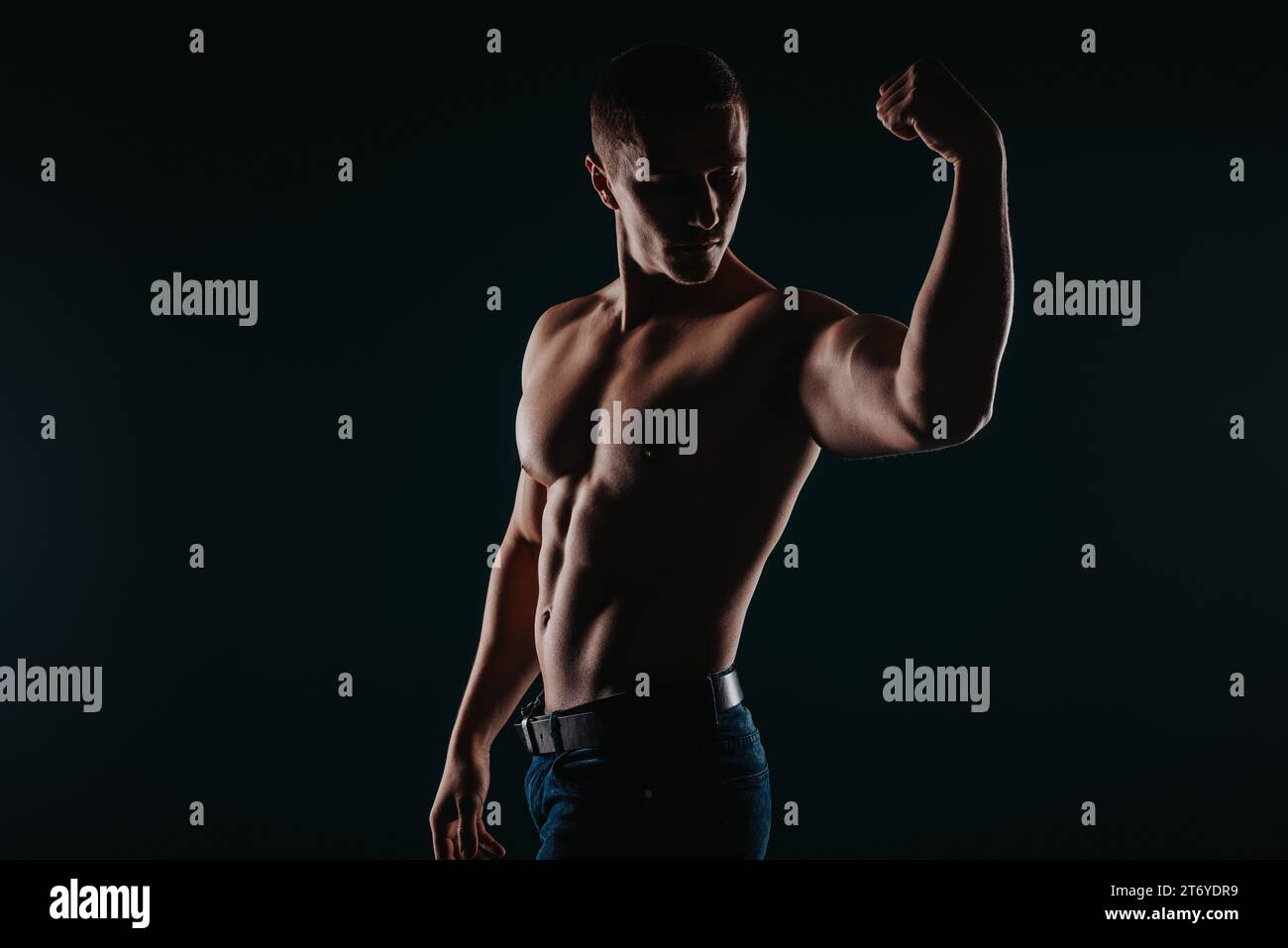 Good-looking and muscular man flexing his bicep Stock Photo - Alamy