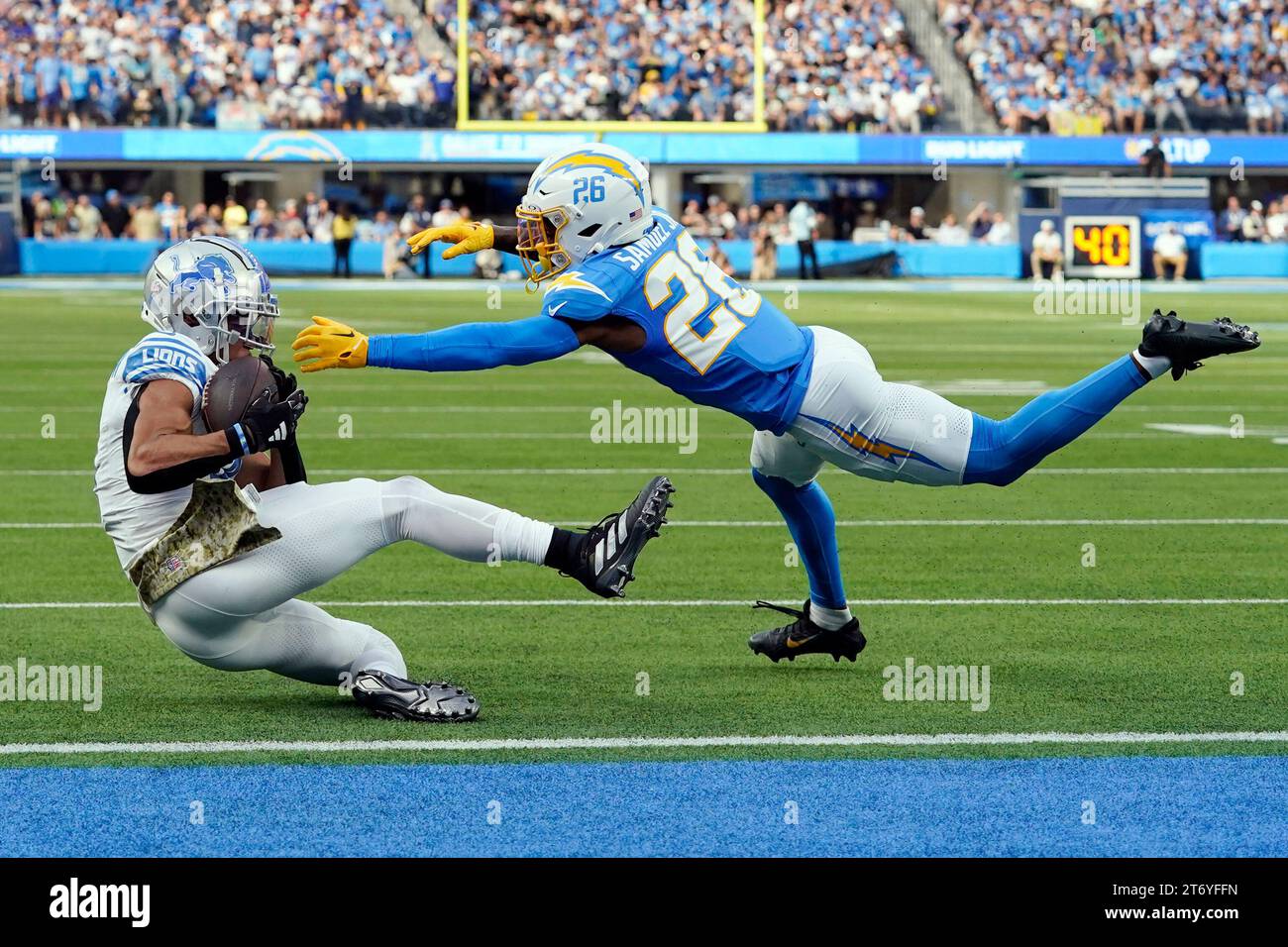 Detroit Lions wide receiver Amon-Ra St. Brown (14) makes a catch nex to ...