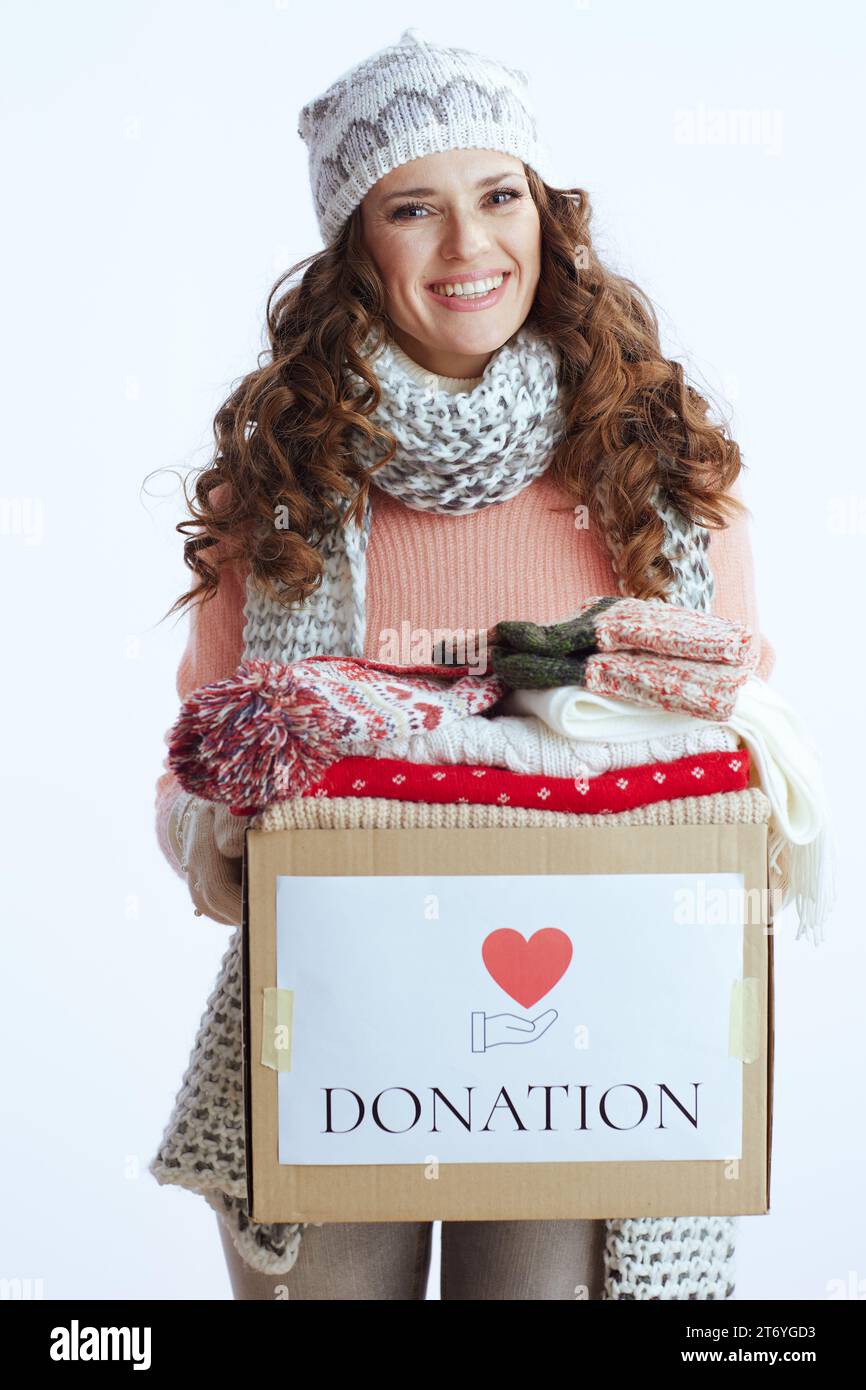 Hello winter. smiling modern 40 years old woman in sweater, mittens ...