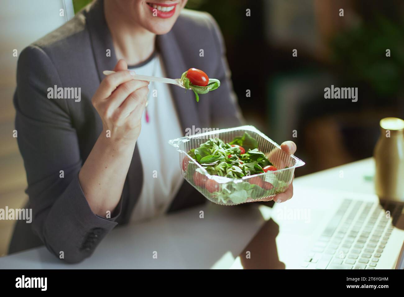 Sustainable workplace. happy modern 40 years old accountant woman in a ...