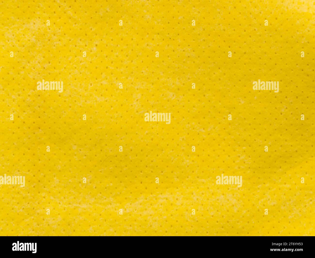 Tiny dotted yellow fabric textile textured Stock Photo - Alamy