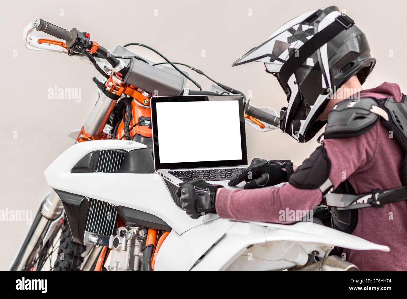 Stylish rider trying diagnose motorbike problem Stock Photo - Alamy