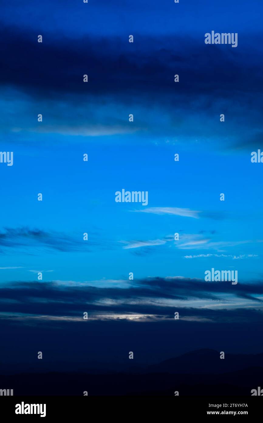 Starry night with clouds blue shades Stock Photo - Alamy