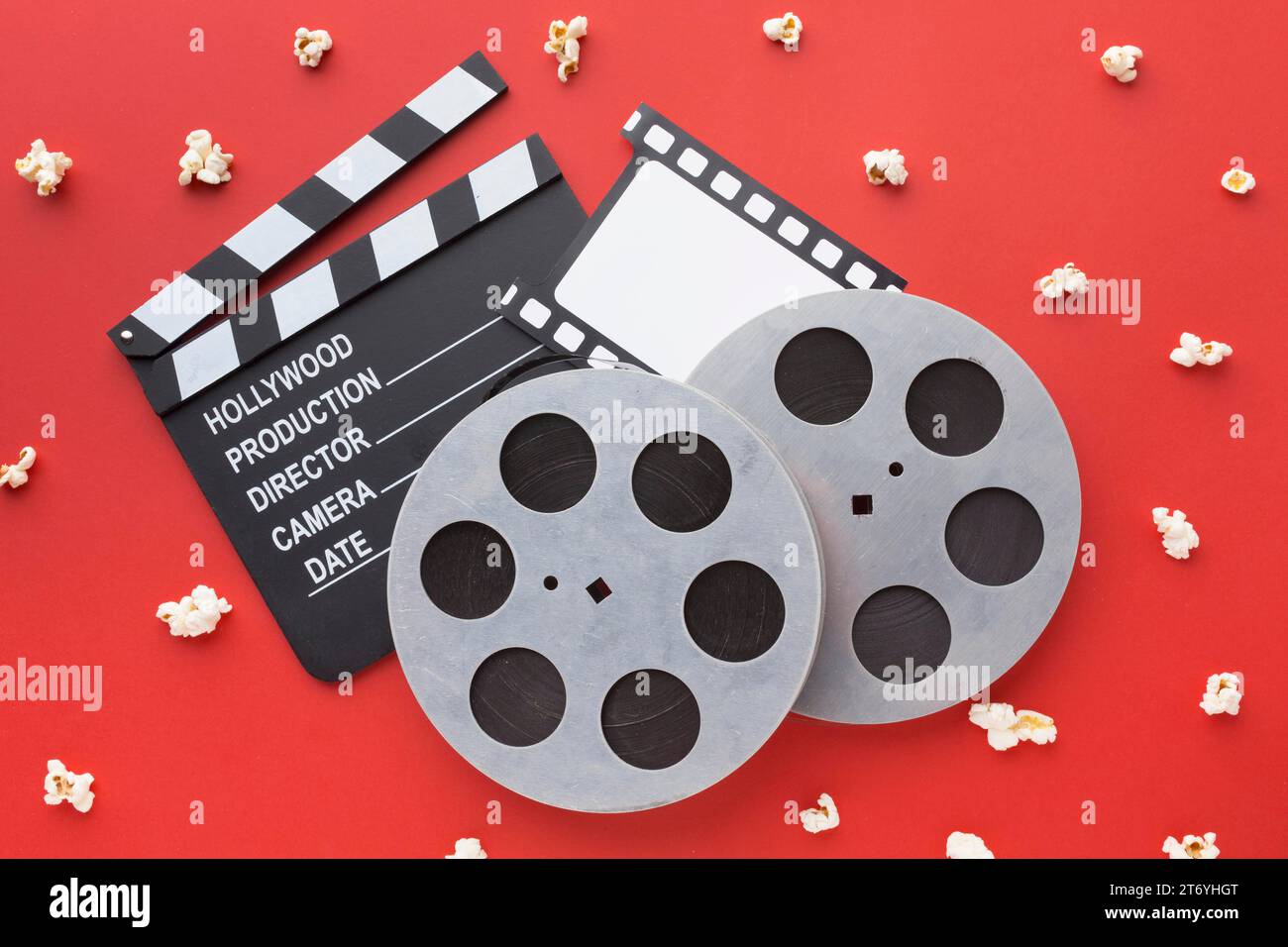 Top view movie elements red background Stock Photo - Alamy