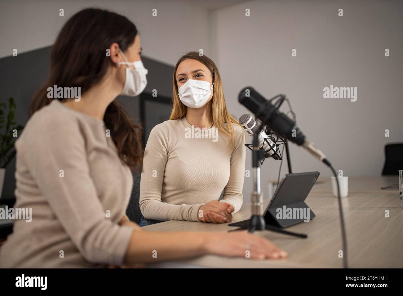 Women doing radio with medical masks Stock Photo - Alamy