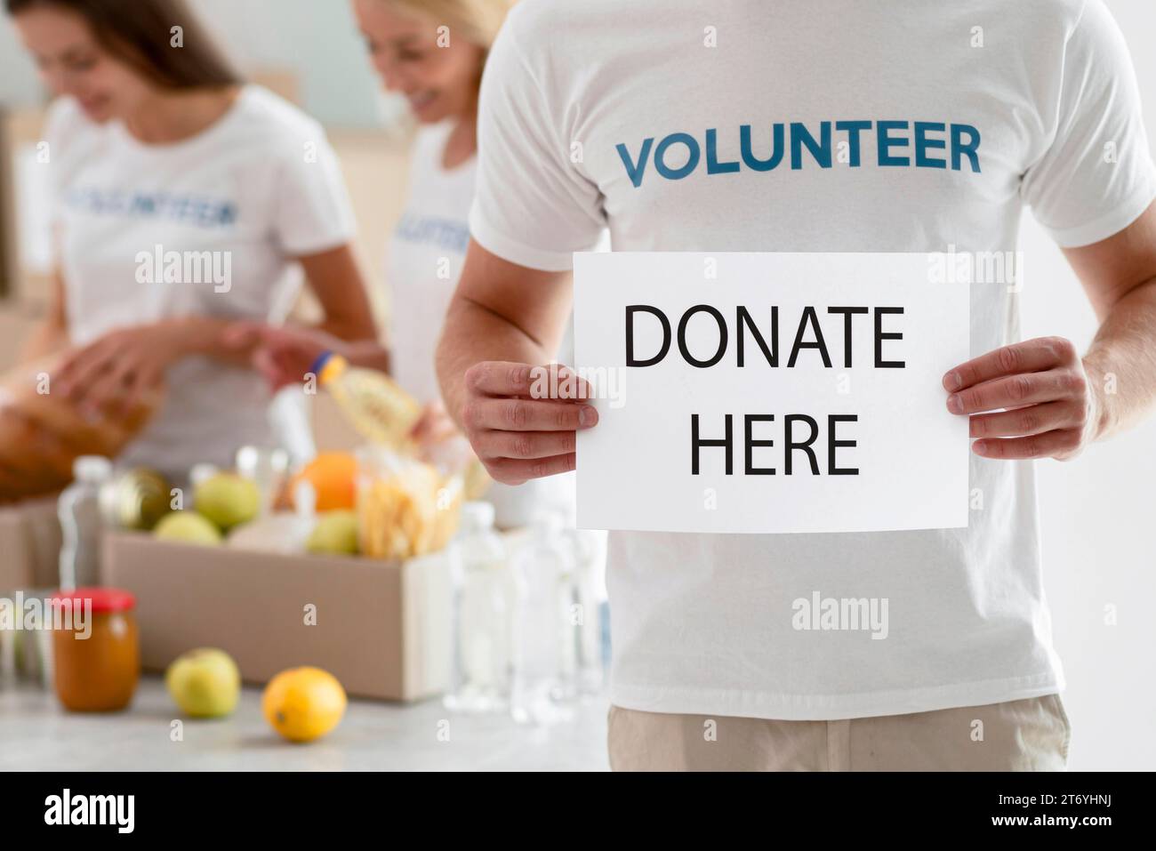 Volunteer hold placard hi-res stock photography and images - Alamy