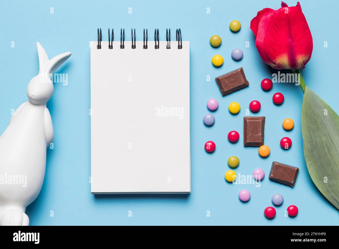 White easter statue spiral notepad tulip gem candies chocolate pieces ...