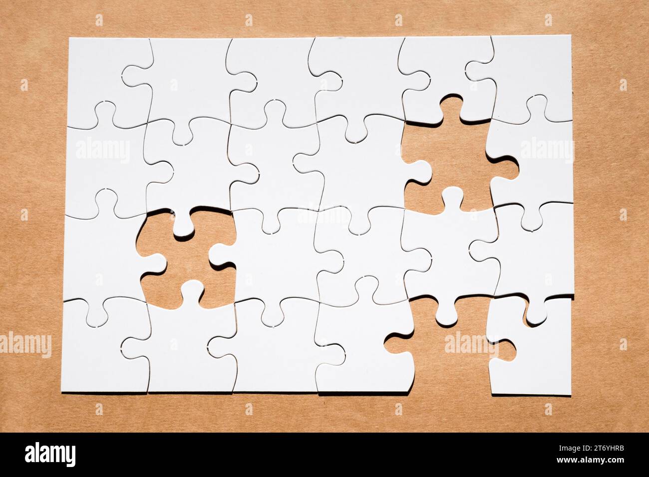 White puzzle grid with missing puzzle piece brown paper textured Stock ...