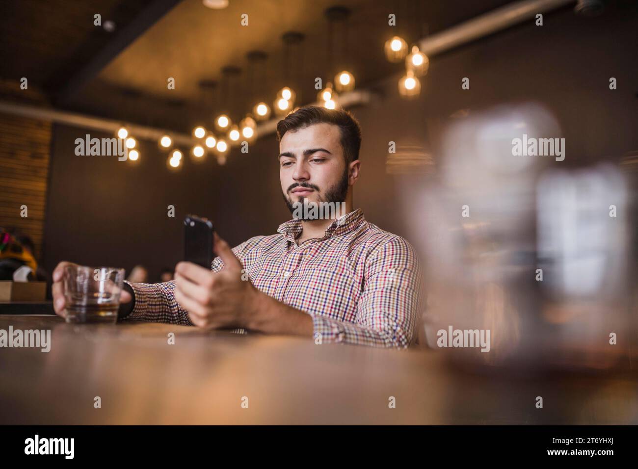 Bearded man smartphone glass hi-res stock photography and images - Alamy