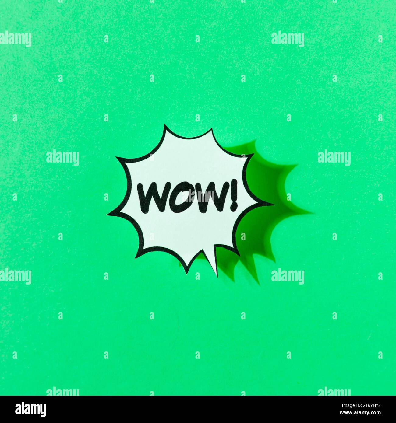 Wow word pop art retro illustration green background Stock Photo - Alamy