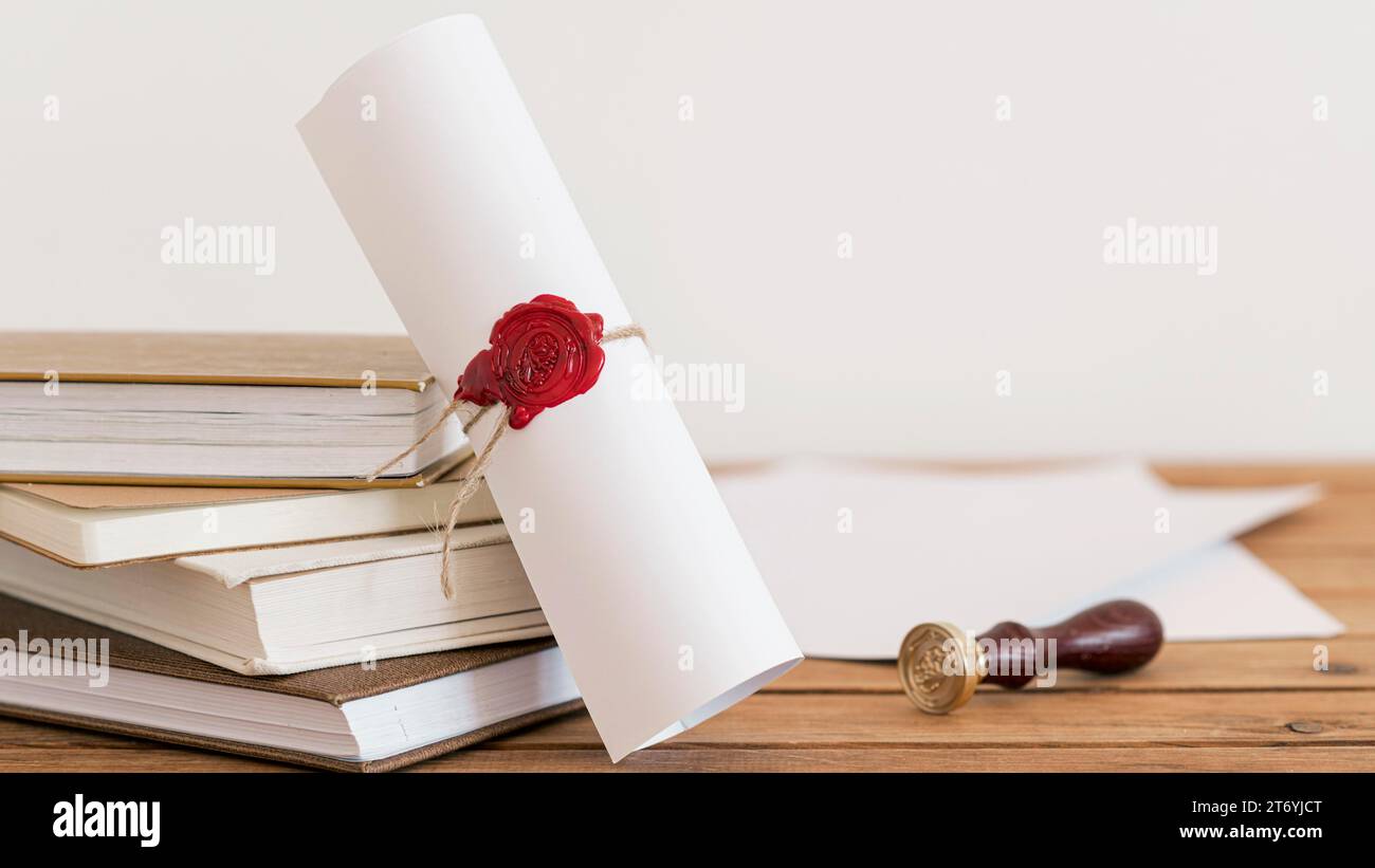 Certificate with ribbon bow office desk Stock Photo - Alamy