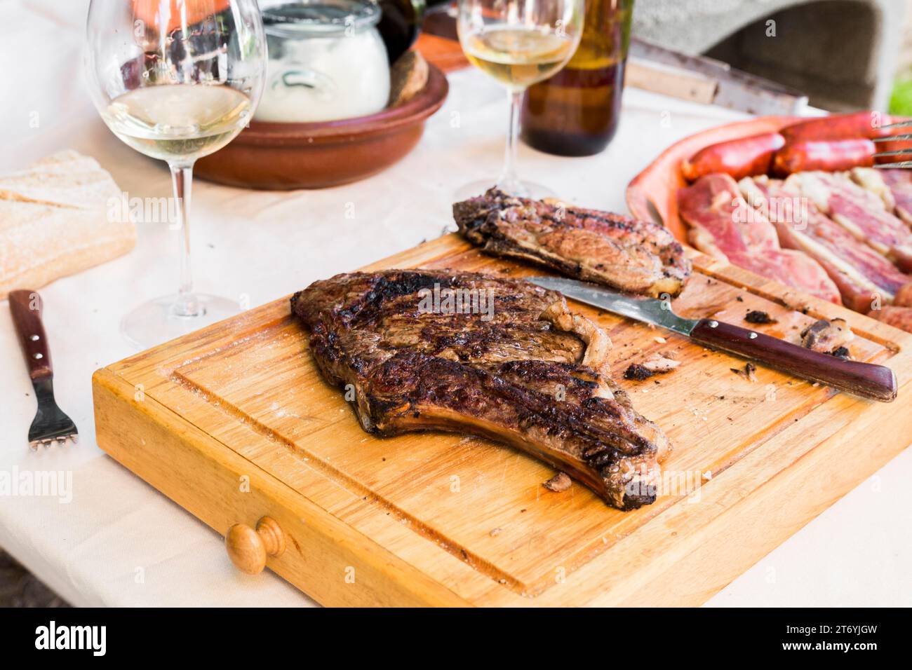 Close up cooked meat knife wooden chopping board Stock Photo - Alamy