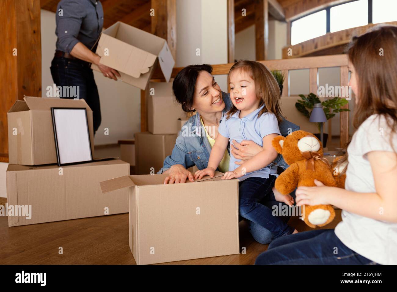 Close up family packing together Stock Photo - Alamy