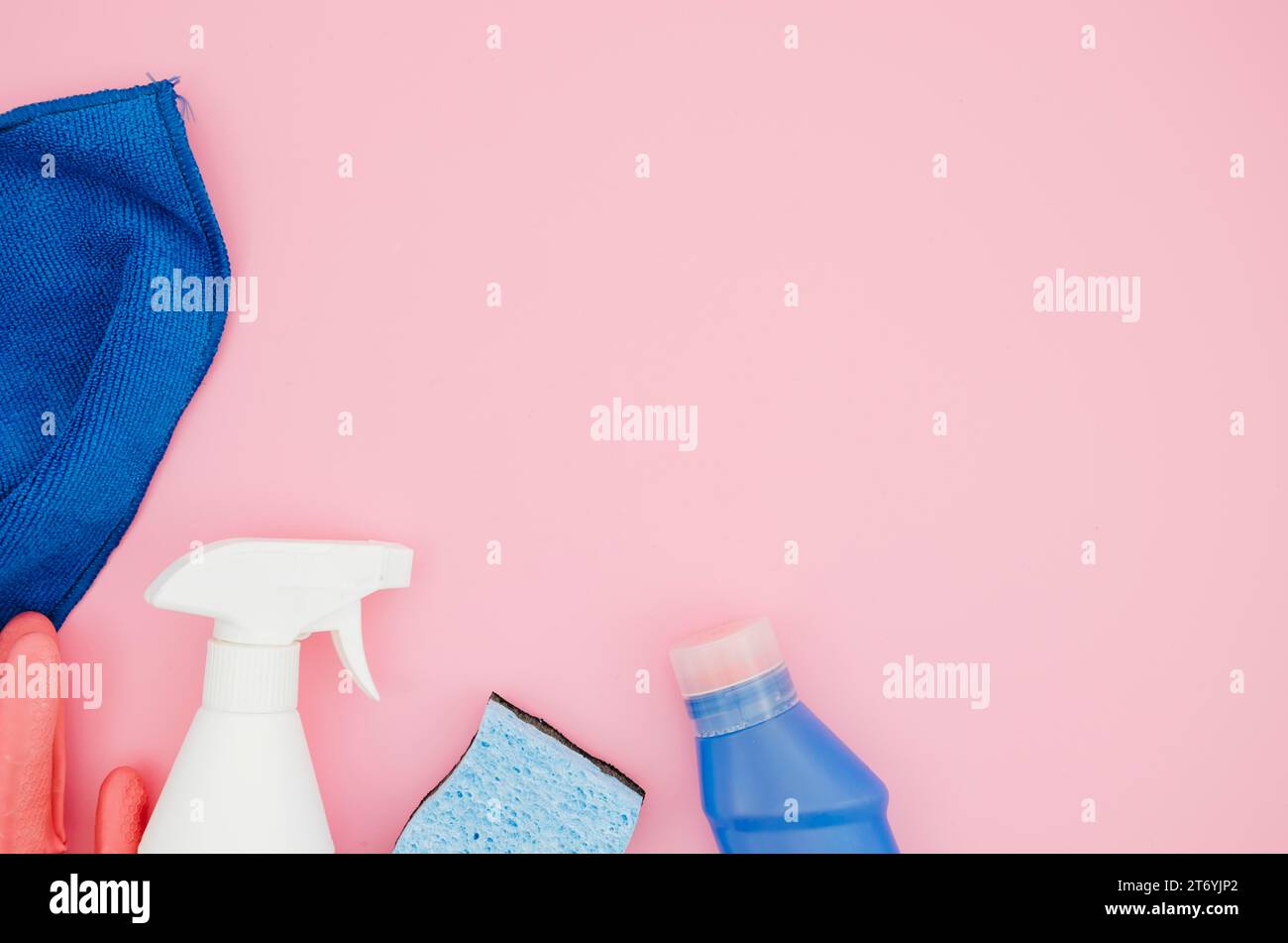 Collection house cleaning supplies pink backdrop Stock Photo - Alamy