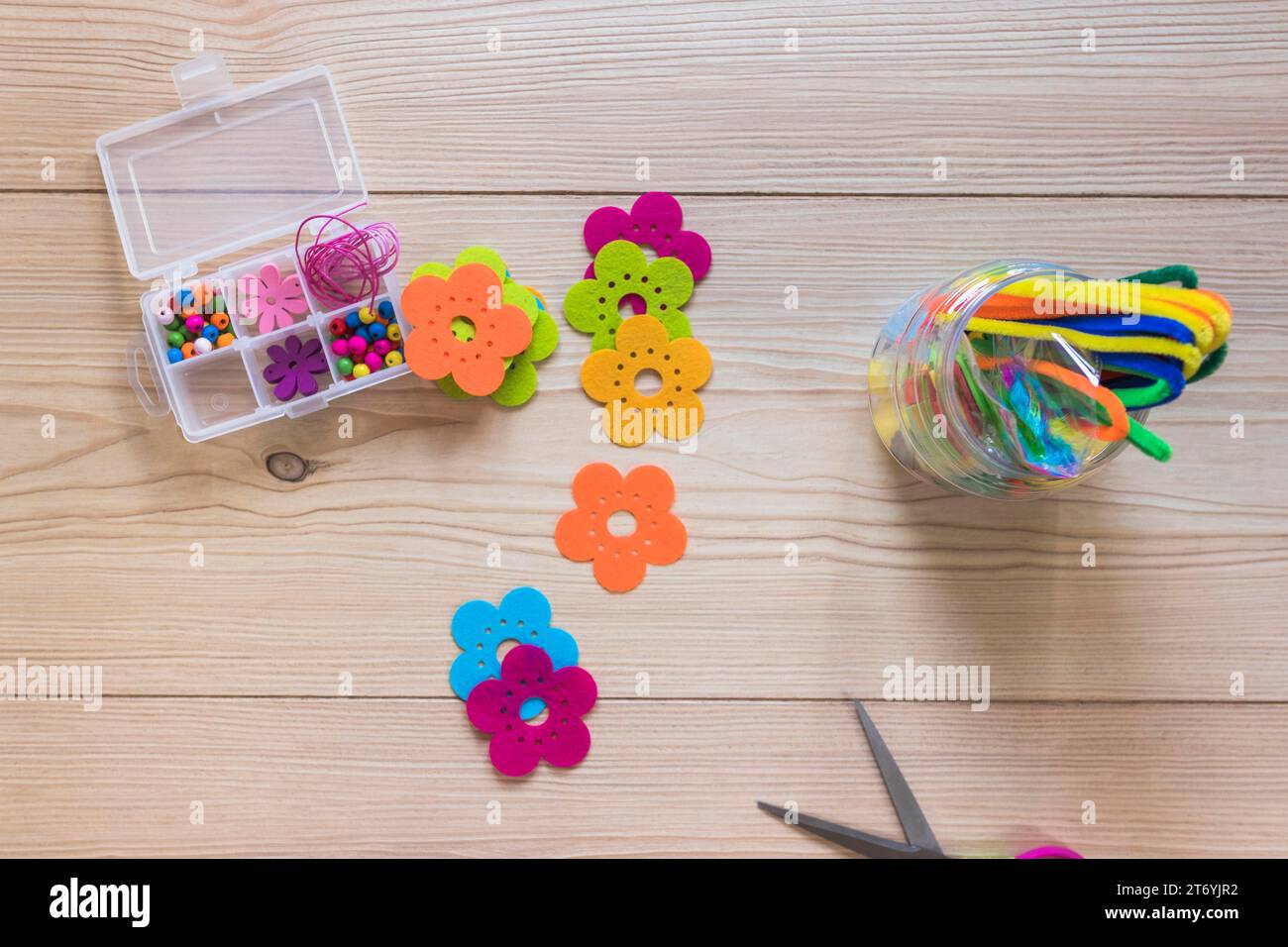 Colorful flower patch chenille stems beads box wooden backdrop Stock ...