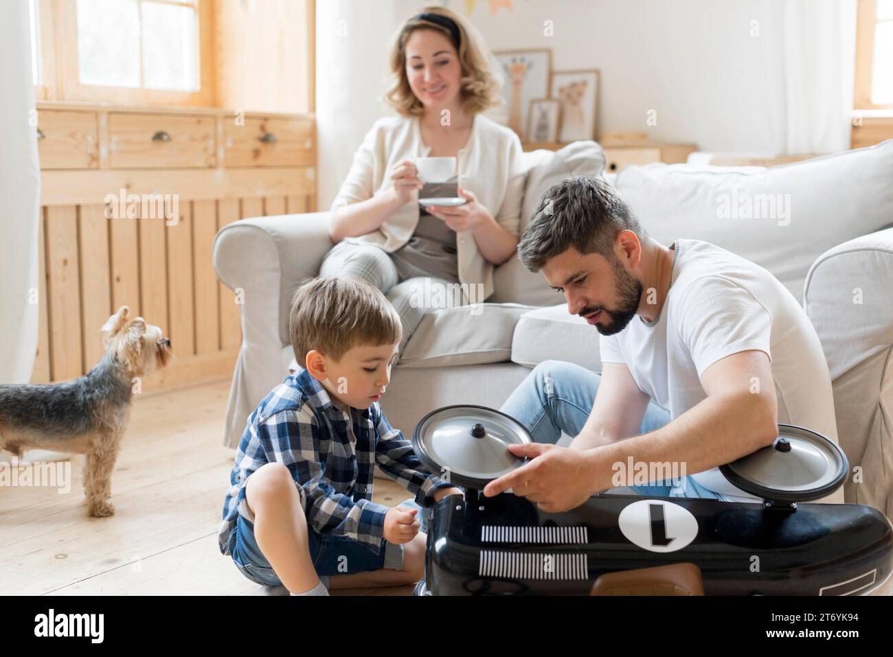 Father son fixing race car Stock Photo - Alamy