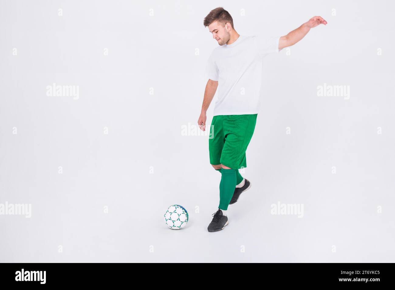 Football player shooting Stock Photo - Alamy