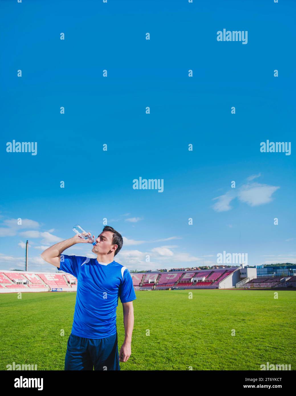 Football player drinking Stock Photo - Alamy