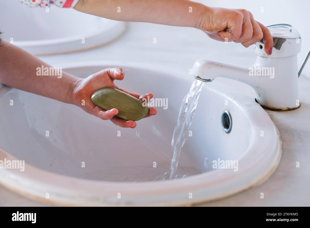 Child washing hands with soap hi-res stock photography and images - Alamy