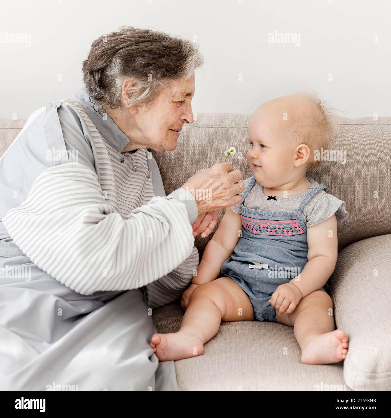 Grandmother happy play with baby Stock Photo - Alamy