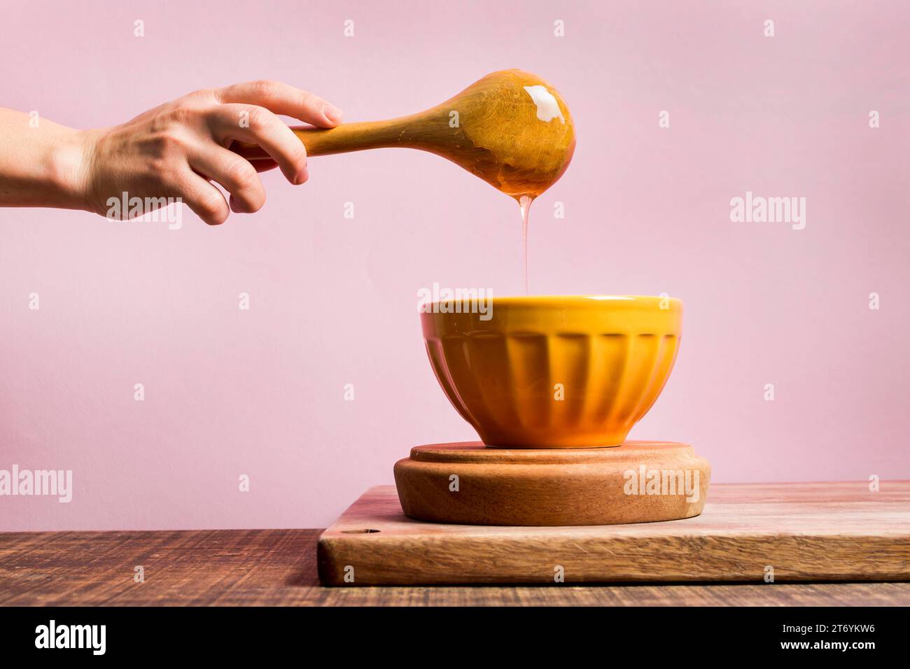 Hand holding spoon Stock Photo - Alamy