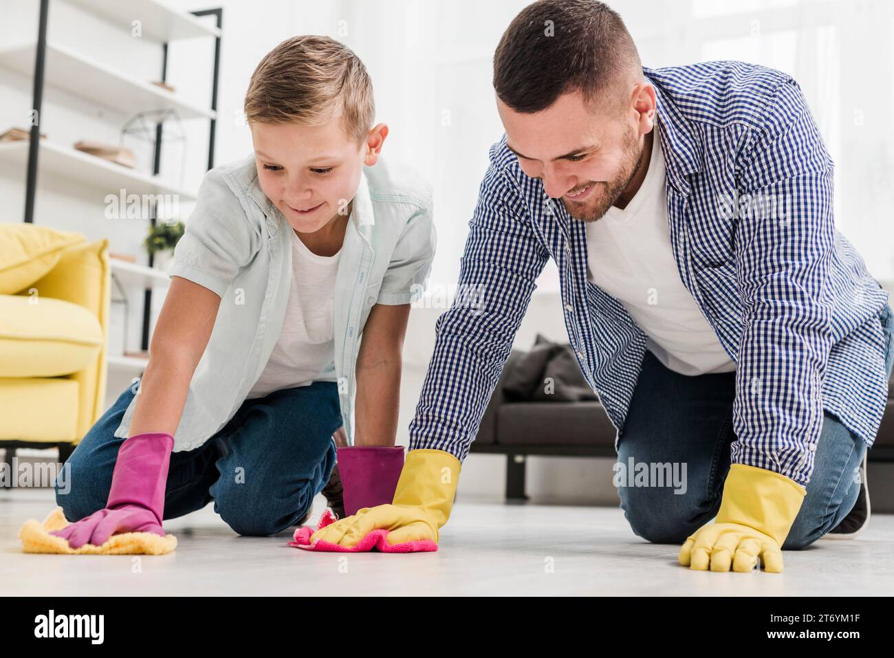 Man boy cleaning floor Stock Photo - Alamy