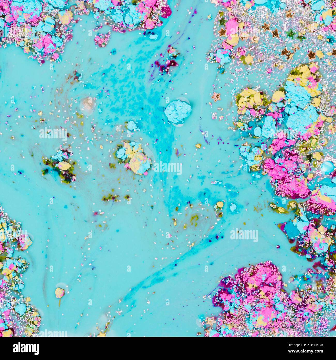 Light blue liquid mixing with ornamental stars bright bits Stock Photo ...