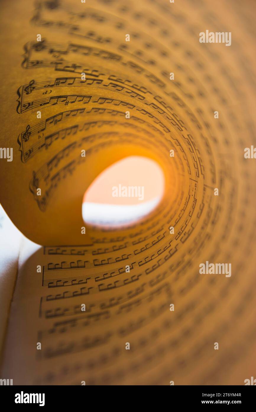 Macro detail rolled up musical note paper Stock Photo - Alamy