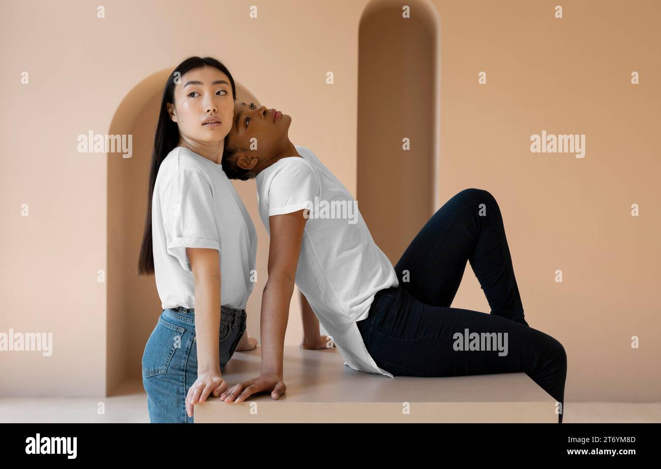 Medium shot two multiethnic female hi-res stock photography and images ...