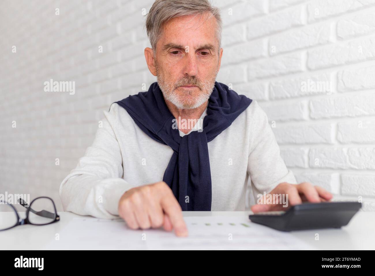 Medium shot man make calculations Stock Photo - Alamy Medium shot man make calculations Stock Photo - Alamy