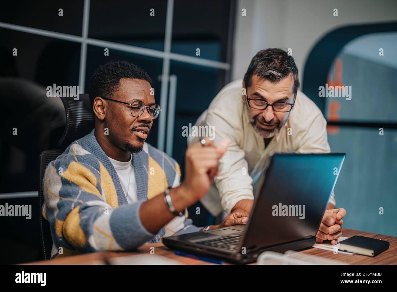 Business people collaborate in a boardroom, discussing projects and sales. Teamwork and ...