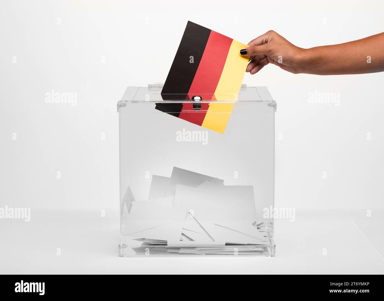 Person putting germany flag card into ballot box Stock Photo - Alamy
