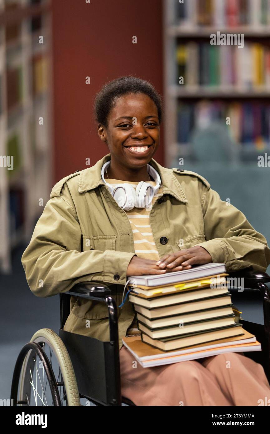 Portrait student wheelchair library Stock Photo - Alamy