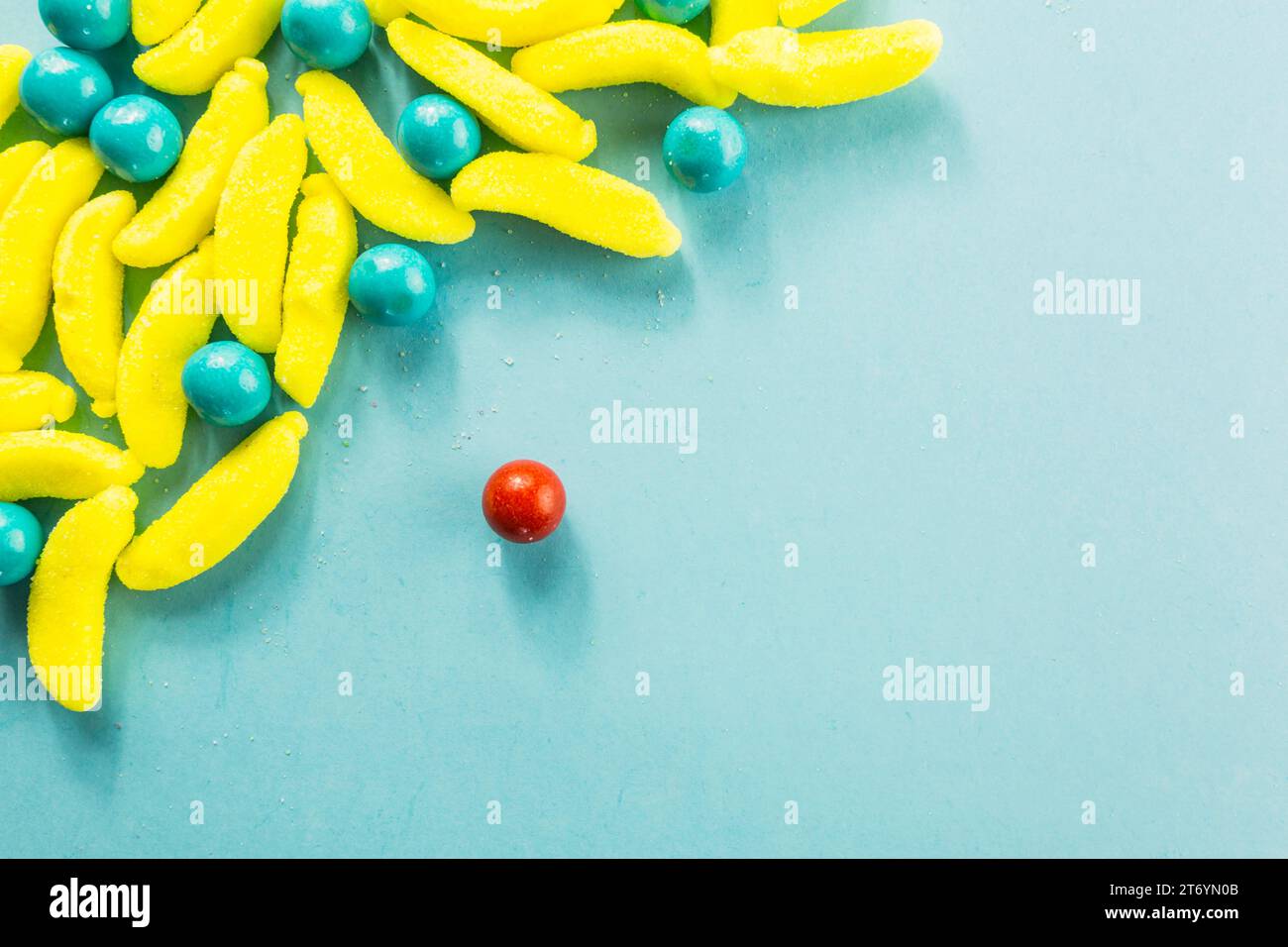 Red candy drop near pile sweets Stock Photo - Alamy