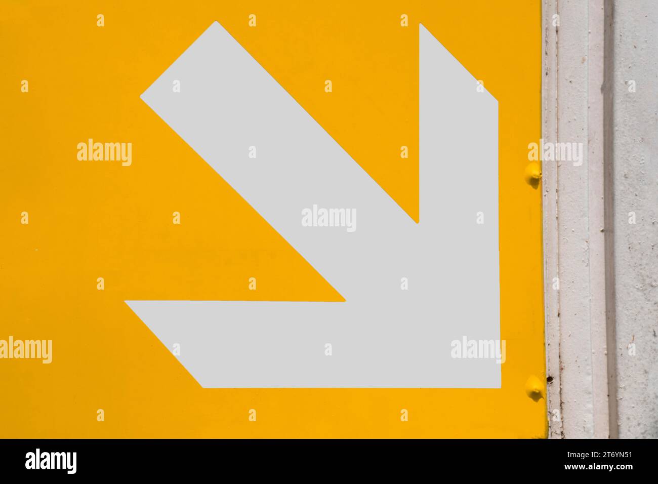 Subway white arrow yellow background Stock Photo - Alamy