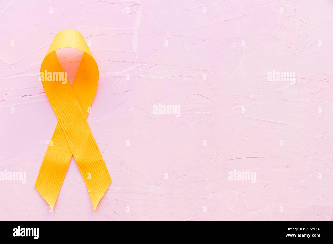 Yellow ribbon symbolic color sarcoma bone cancer pink backdrop Stock ...