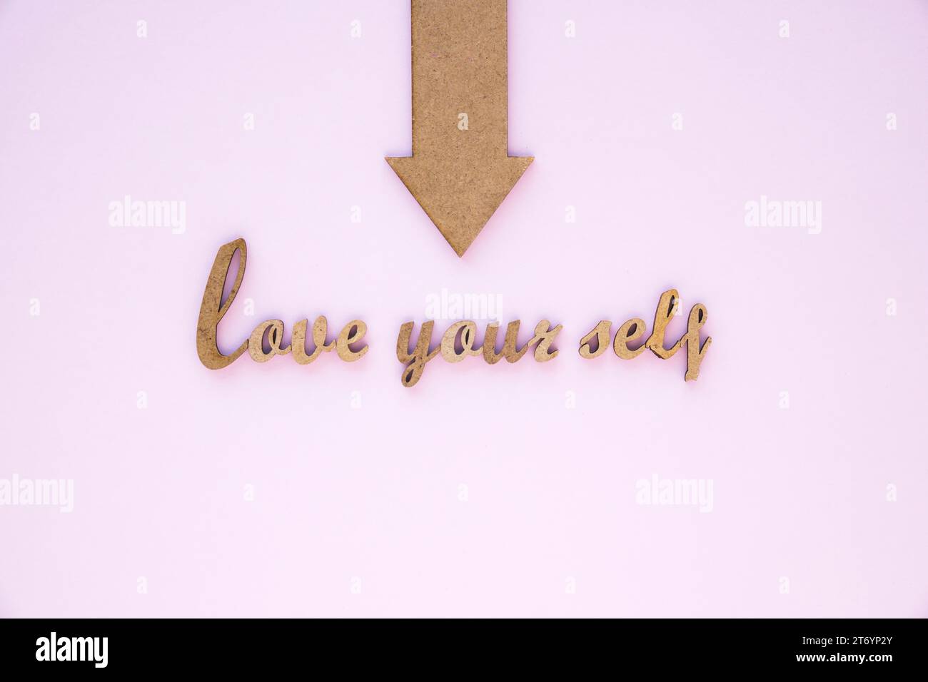Arrow pointing love yourself writing Stock Photo - Alamy